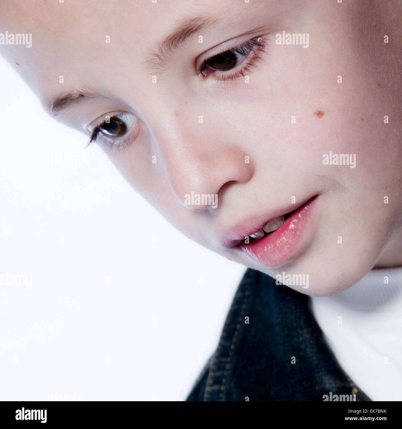 Young boy in thinking pose Stock Photo - Alamy