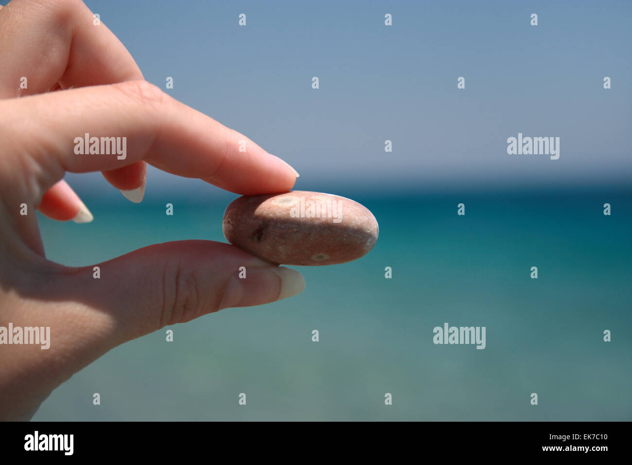 Stone in hand Stock Photo - Alamy
