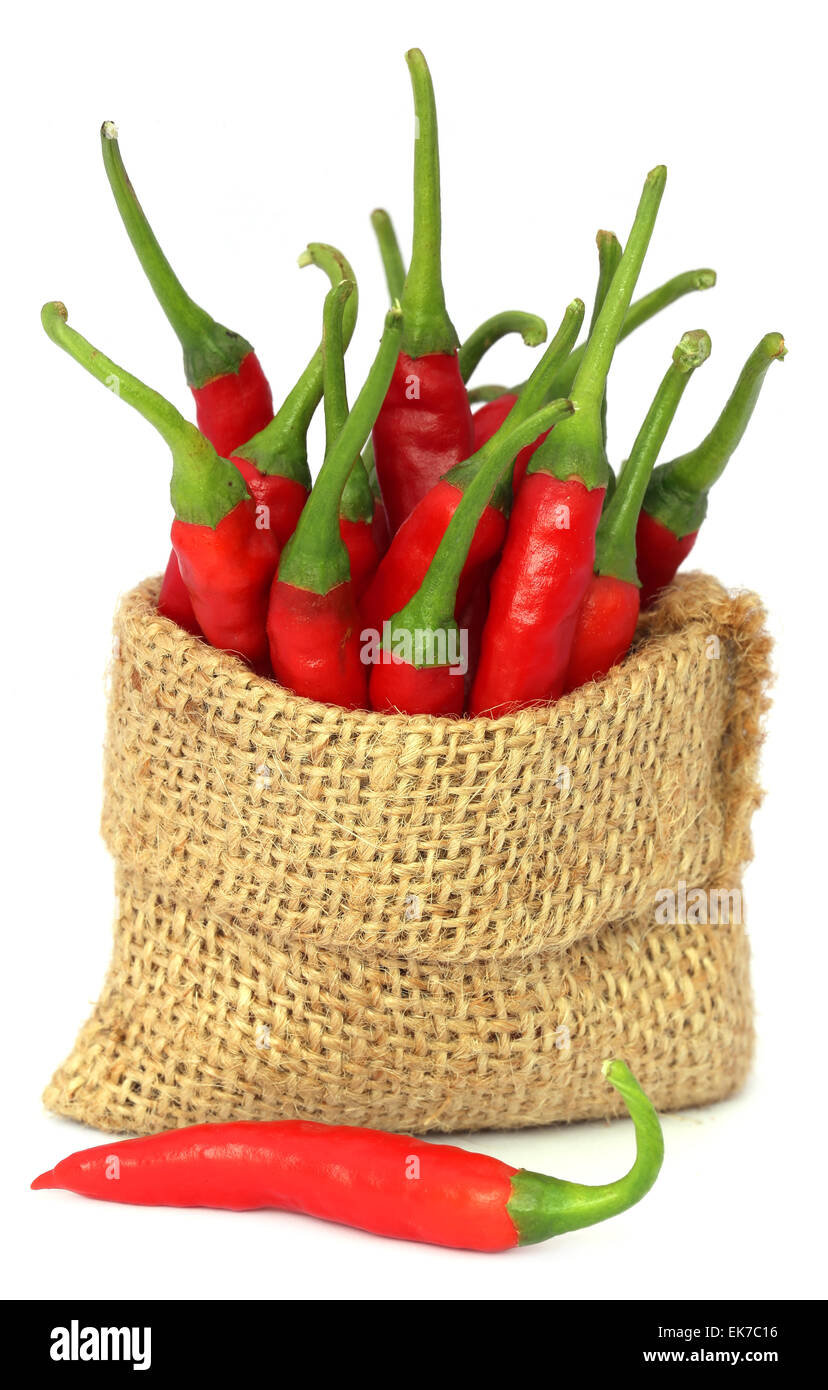 Red chili peppers in a sack bag over white background Stock Photo - Alamy