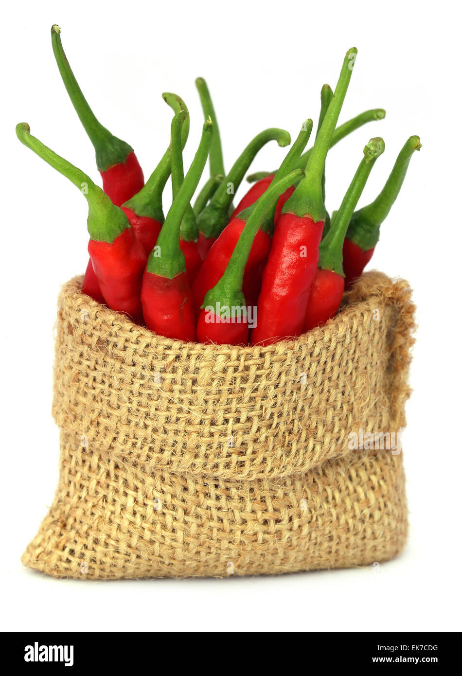 Red chili peppers in a sack bag over white background Stock Photo - Alamy