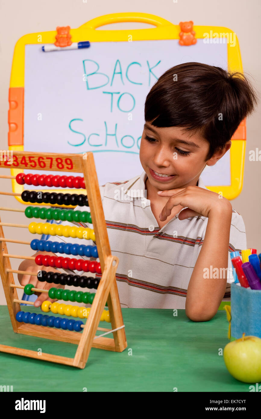 A student solving a math assignment Stock Photo - Alamy