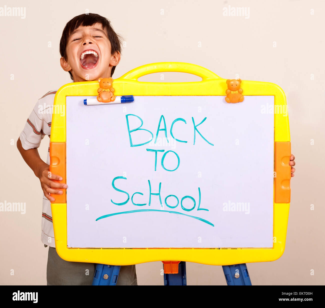 Little boy screaming with a whitebaord Stock Photo - Alamy