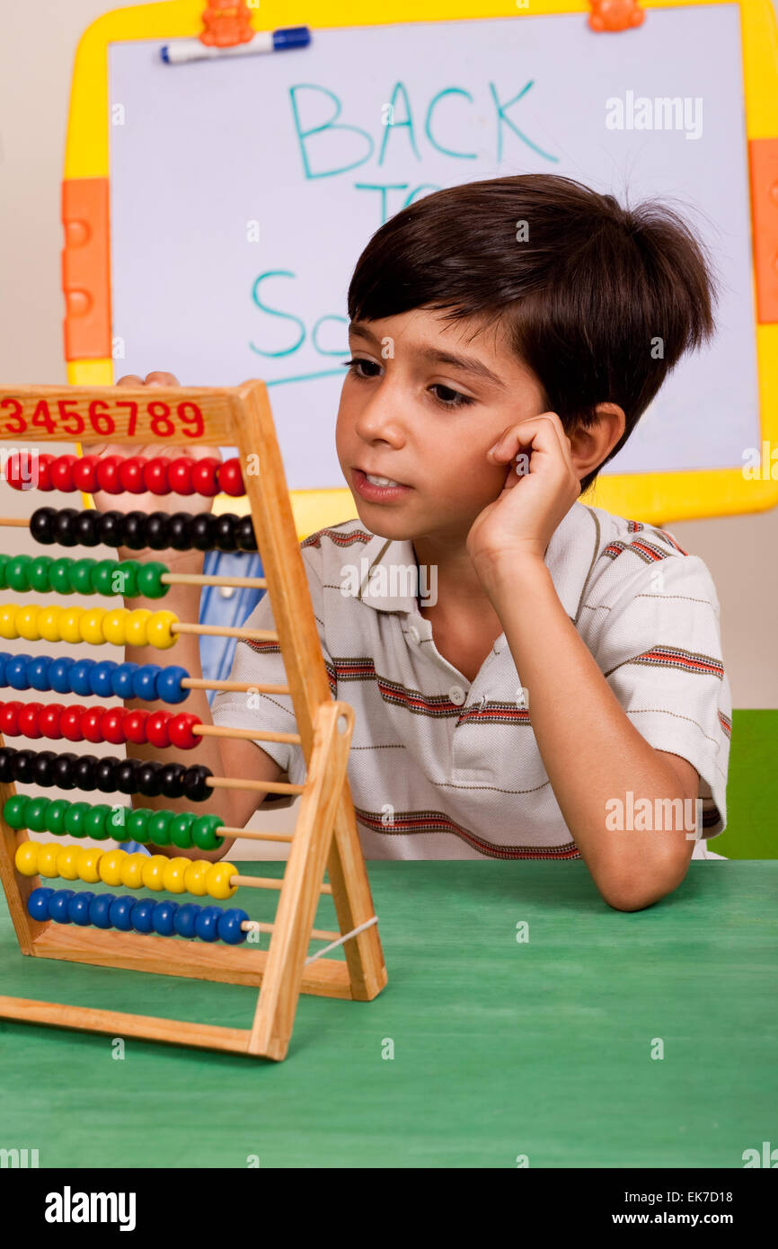 A student solving a math assignment Stock Photo - Alamy