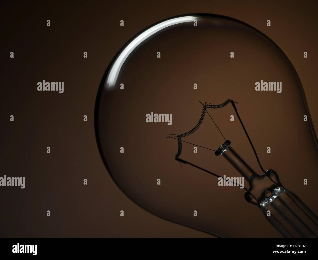 Bulb light over brown Stock Photo - Alamy