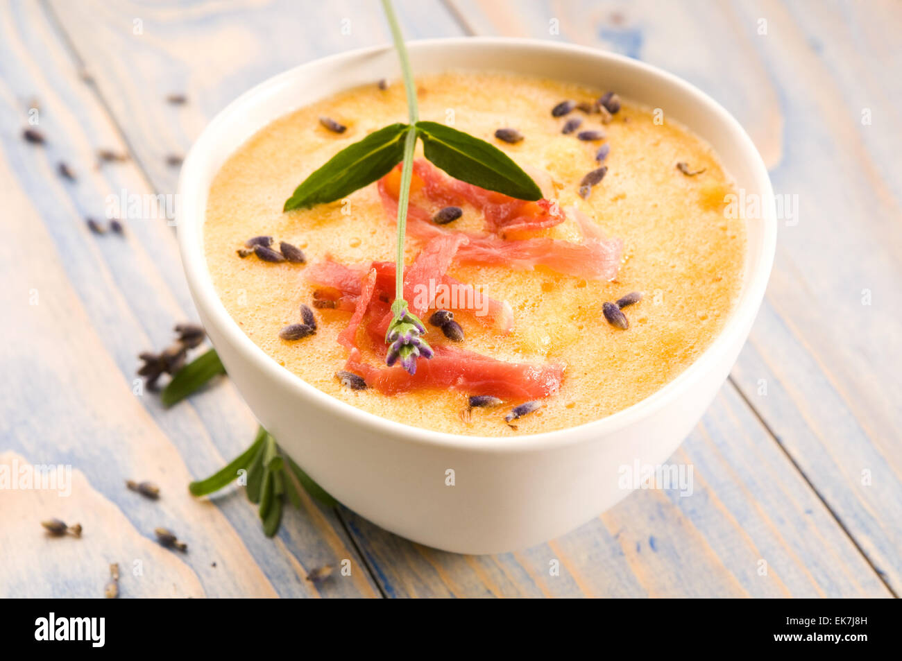 fresh melon soup with parma ham and lavender flower Stock Photo - Alamy