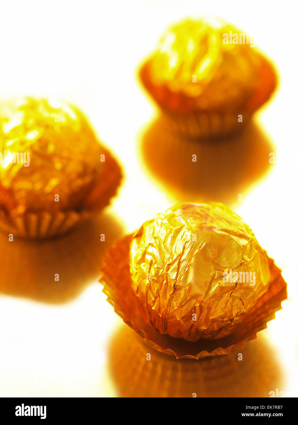 candy in gold wrappers Stock Photo - Alamy