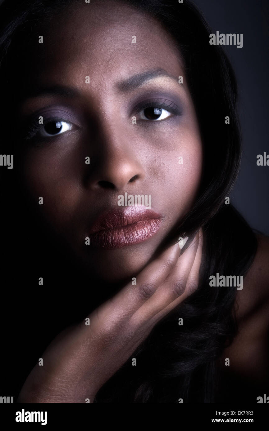 Dark female model looking serious Stock Photo - Alamy