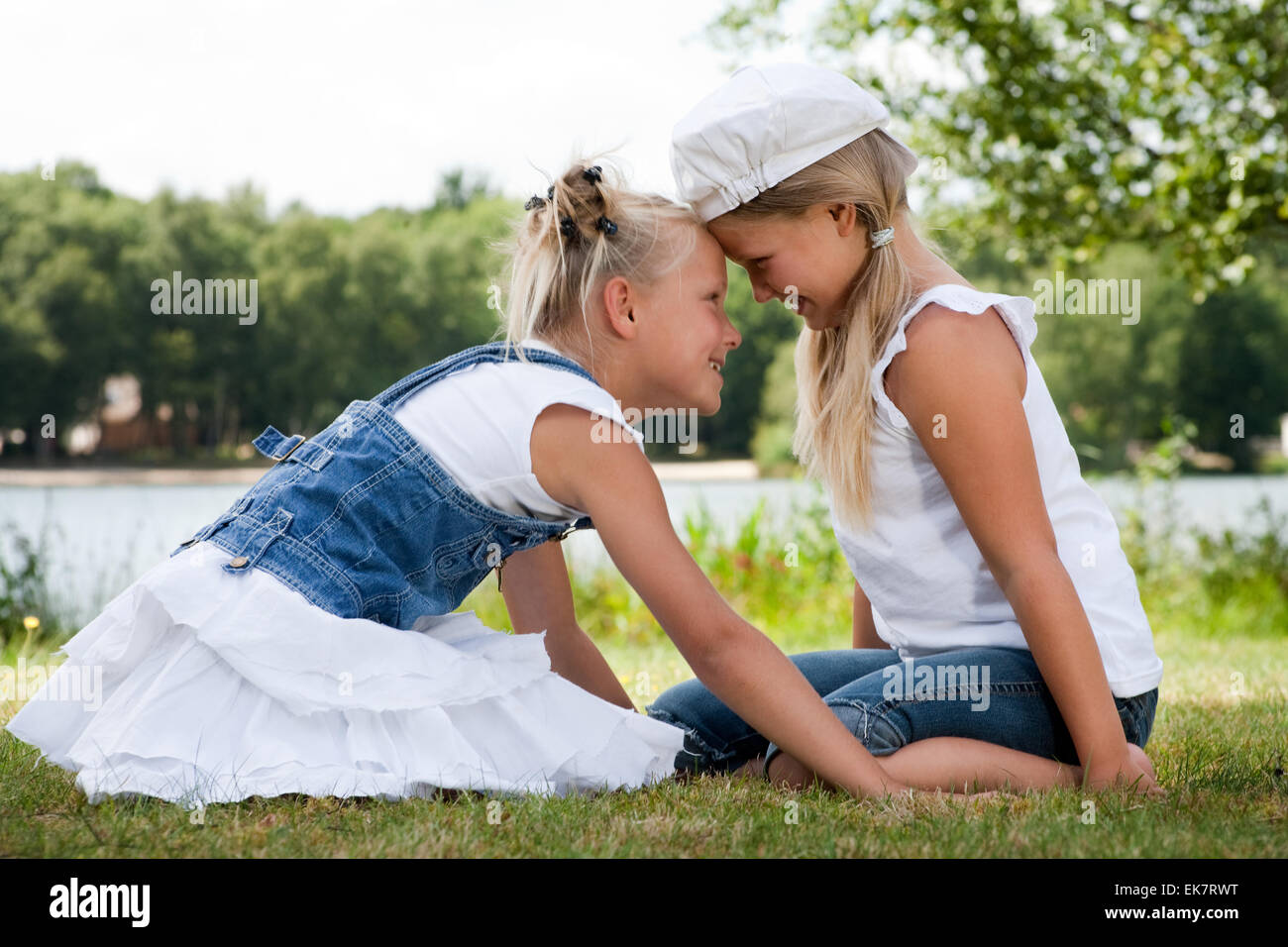 Head hugs and smiling Stock Photo - Alamy