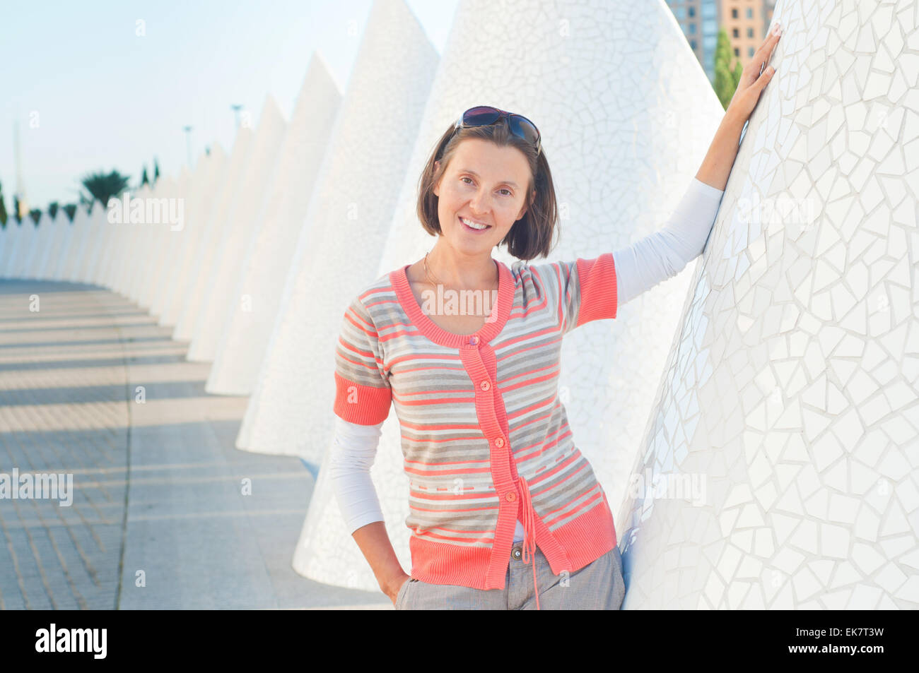 A young woman walking of modern building Stock Photo - Alamy
