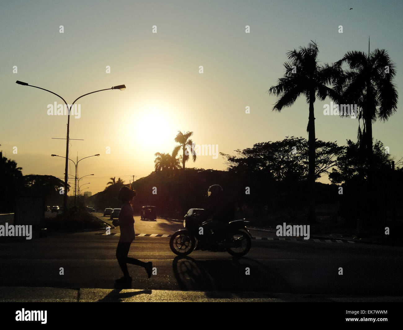 Quezon City, Philippines. 07th Apr, 2015. A Filipino jogger runs around ...