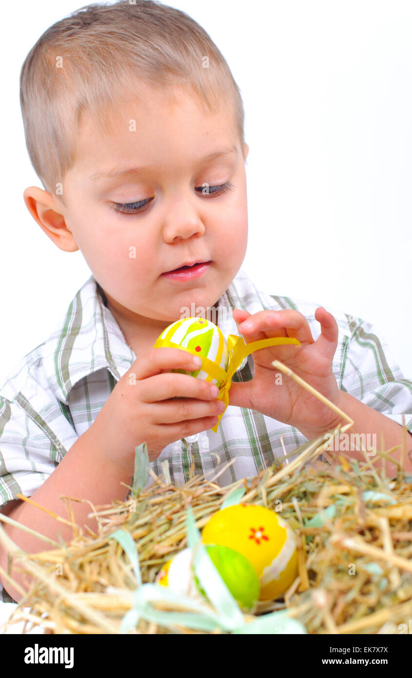 Little boy with easter eggs in basket Stock Photo - Alamy