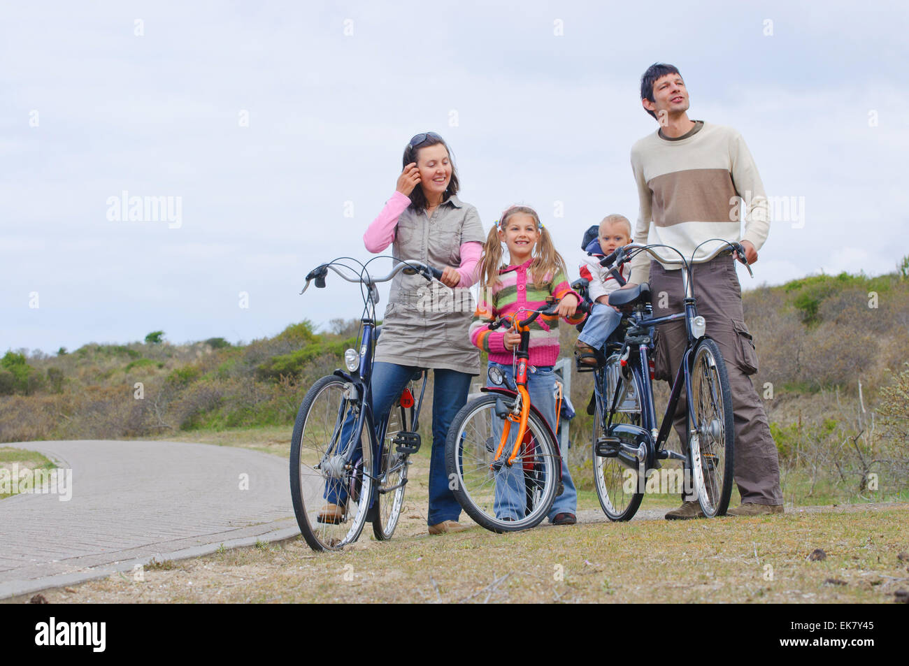 A family with children on their bikes Stock Photo - Alamy