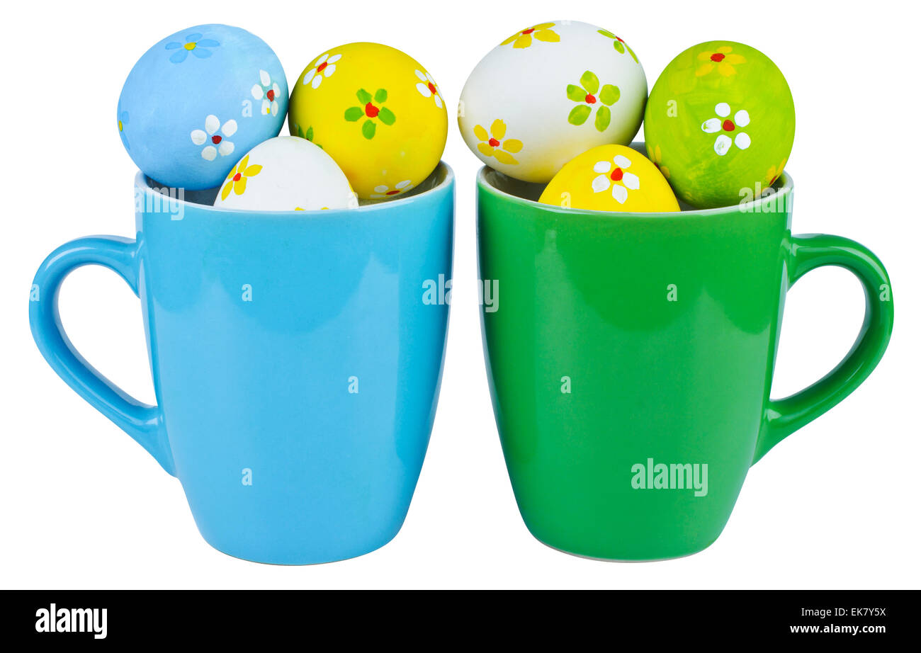 Easter eggs in cups on white background Stock Photo - Alamy