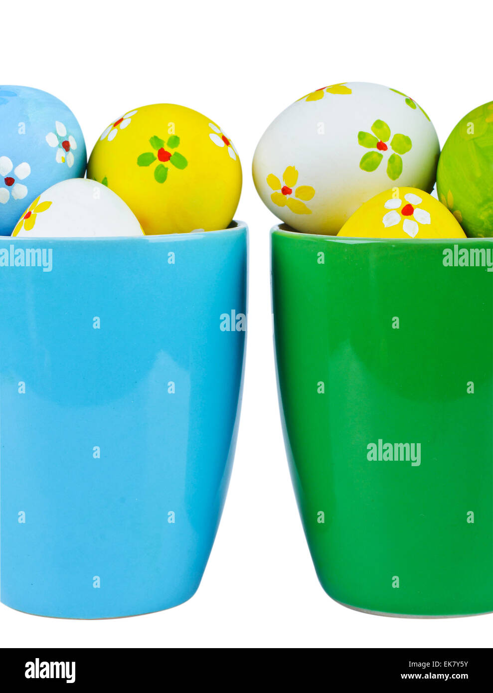 Easter eggs in cups on white background Stock Photo - Alamy