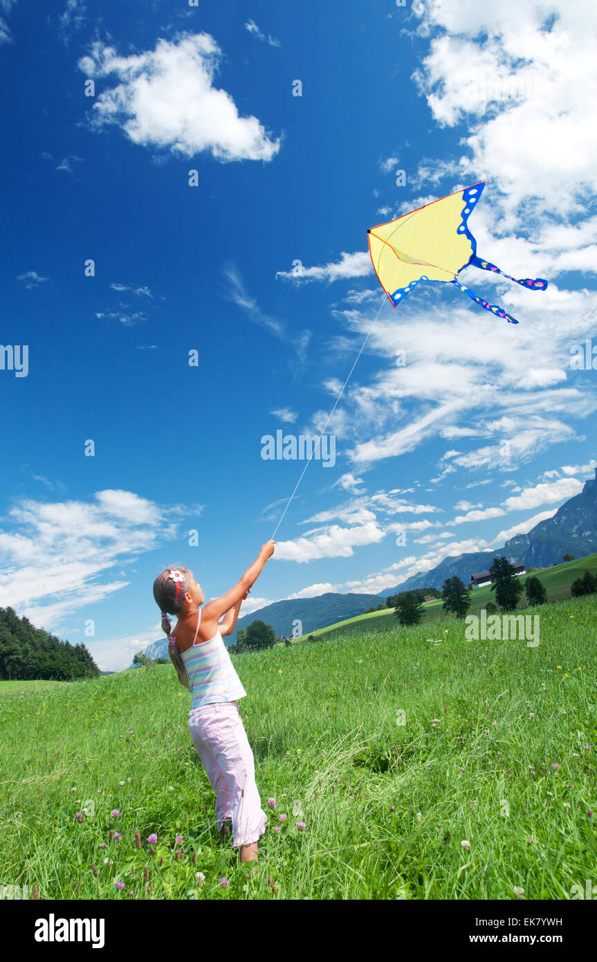 Child Flying A Kite Stock Photo - Alamy