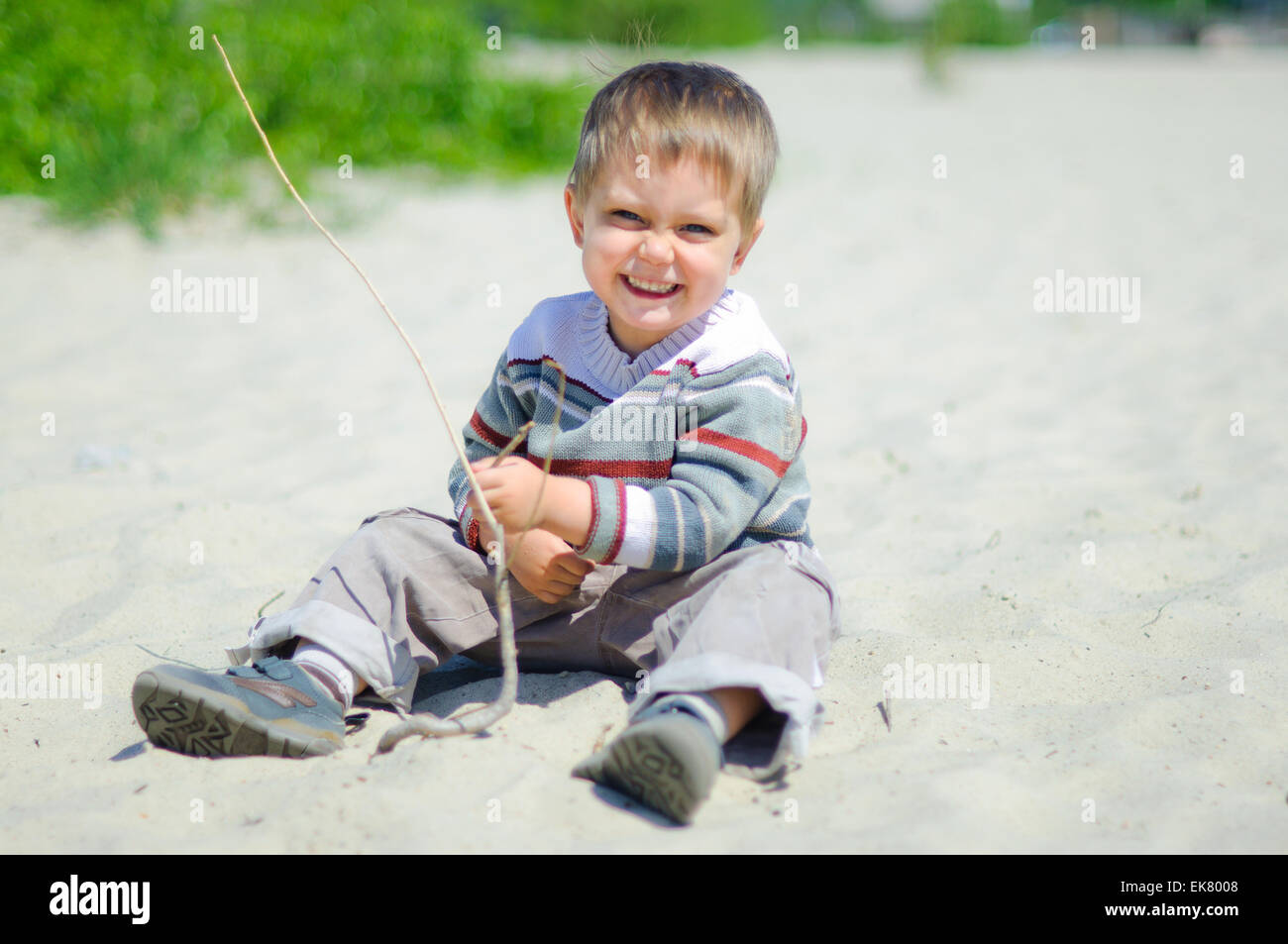 The Boy On Sand Stock Photo - Alamy