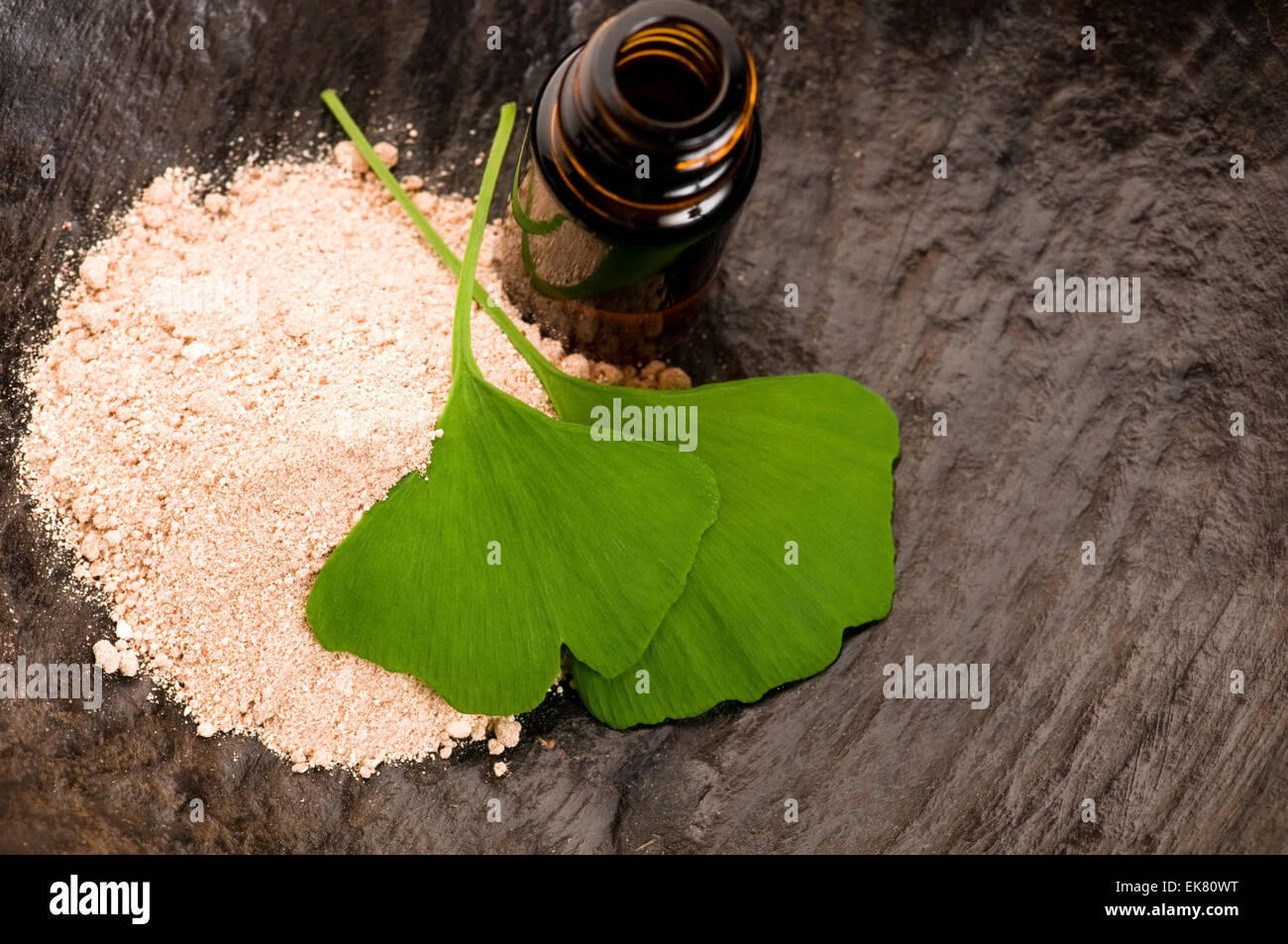 fresh leaves ginko biloba essential oil and powder Stock Photo - Alamy