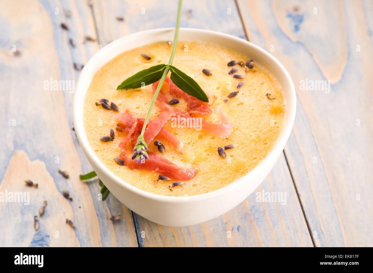fresh melon soup with parma ham and lavender flower Stock Photo - Alamy