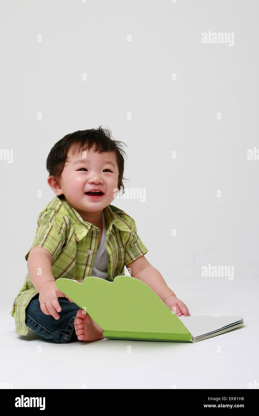 Toddler with a Book Stock Photo - Alamy