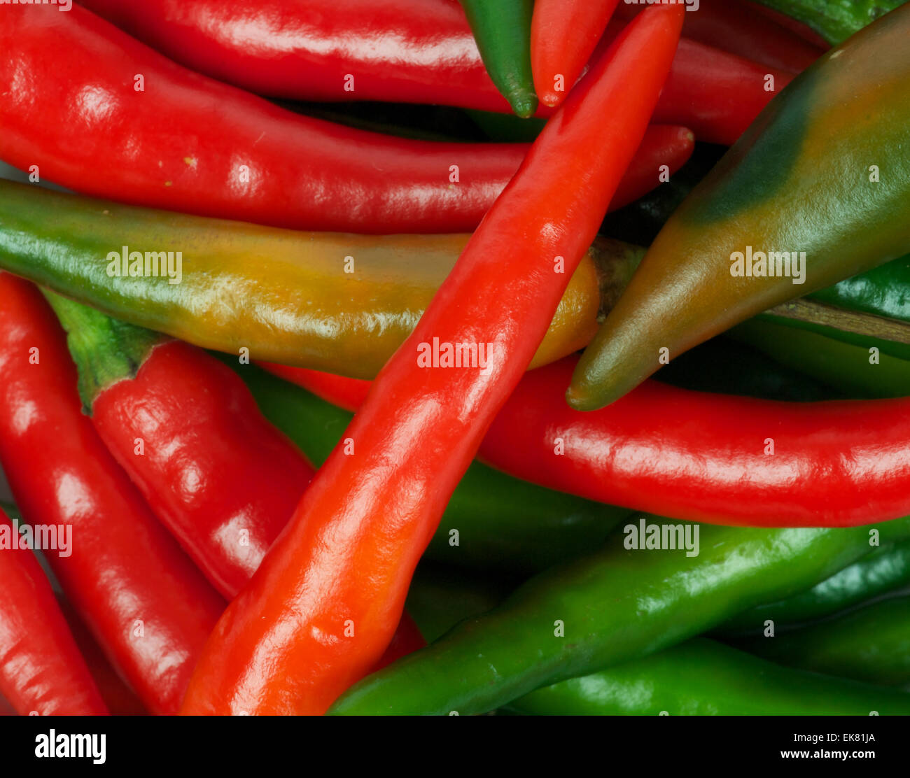 Chili peppers background Stock Photo - Alamy