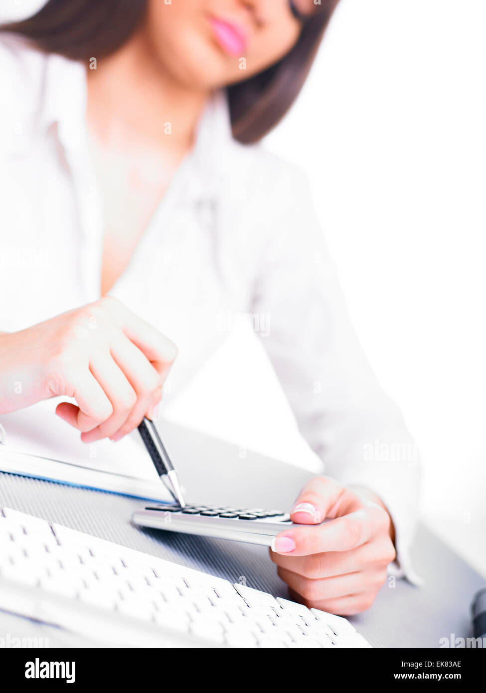 Calculating with calculator hi-res stock photography and images - Alamy