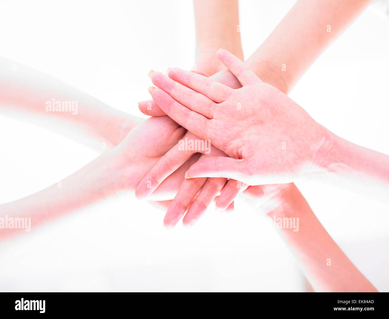 Team join hands Stock Photo - Alamy