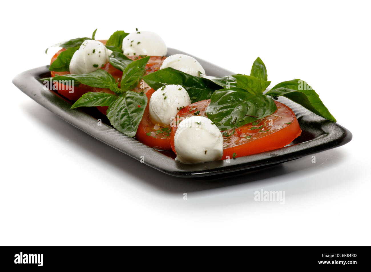 Caprese on Black Plate Stock Photo - Alamy
