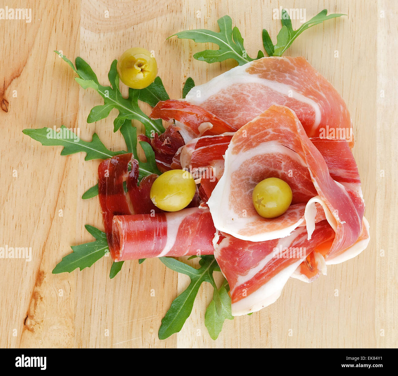 Slices of jamon and olives Stock Photo - Alamy