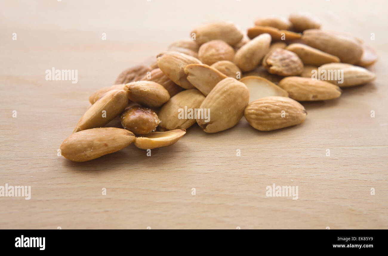 Fried almonds slightly salted isolated over white background Stock ...