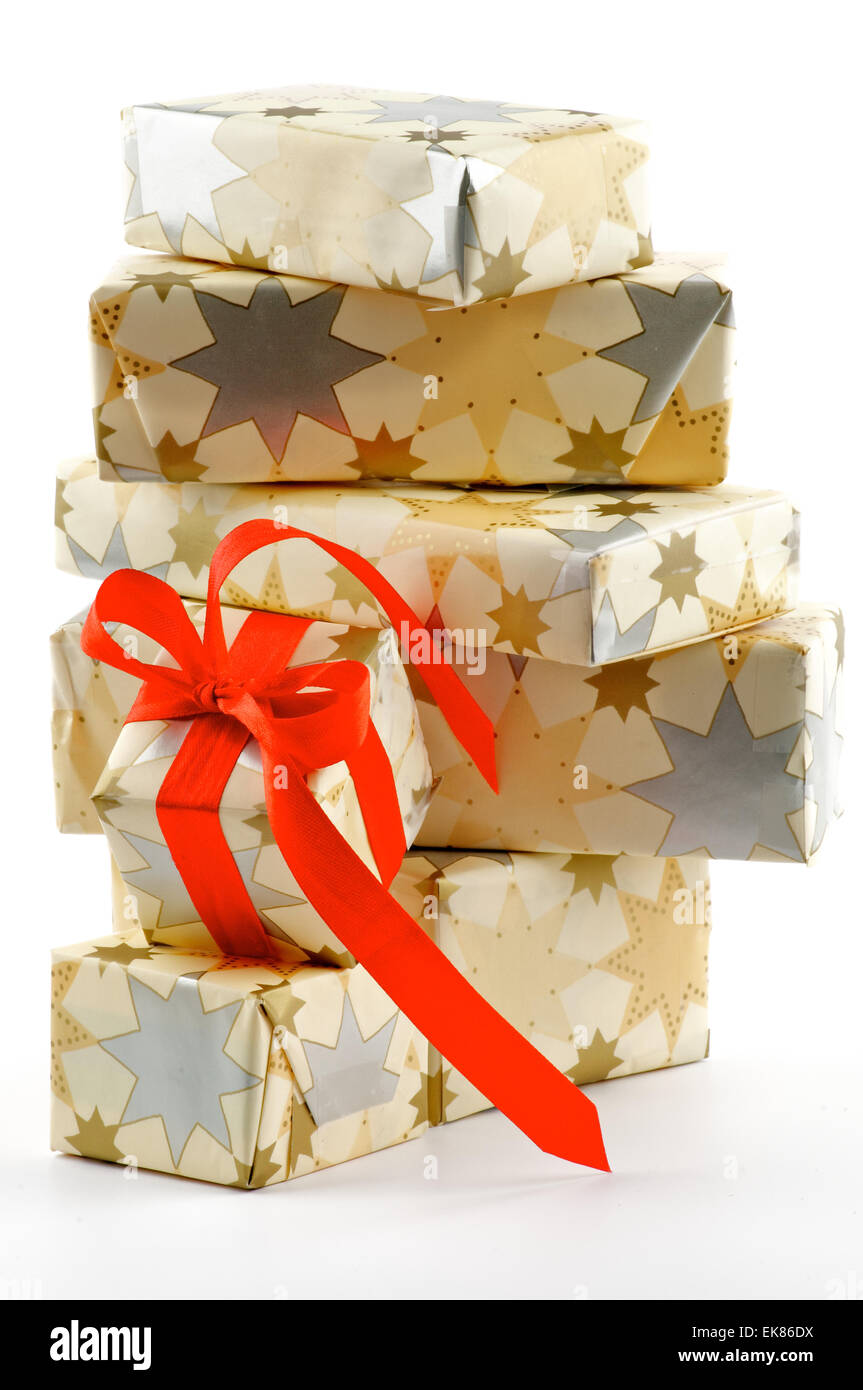 Stack of Gift Boxes and one with Red Bow Stock Photo - Alamy