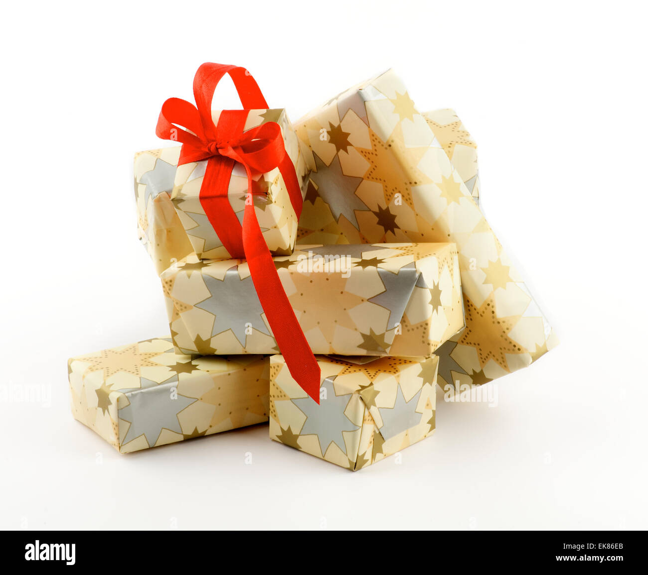 Stack of Gift Boxes and one with Red Bow Stock Photo - Alamy