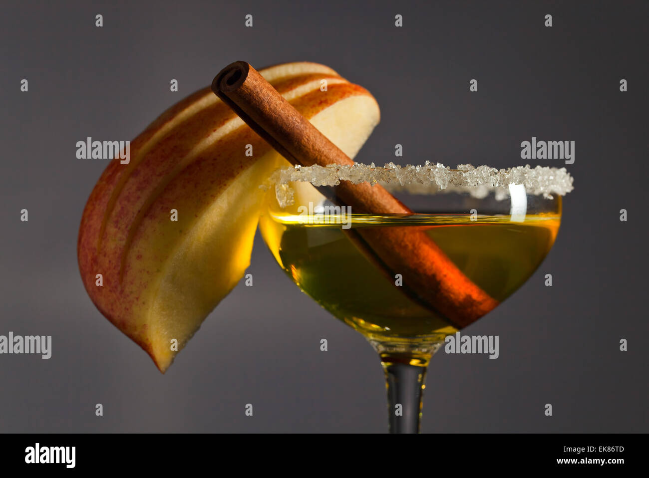 apple liquor with cinnamon on a dark background Stock Photo - Alamy