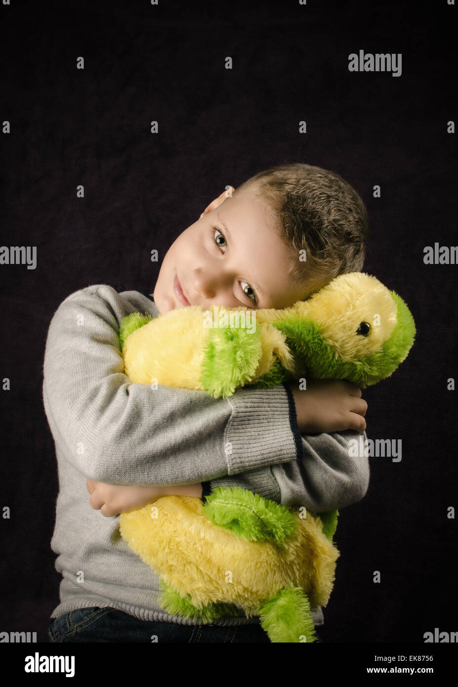 Hugging a toy Stock Photo - Alamy
