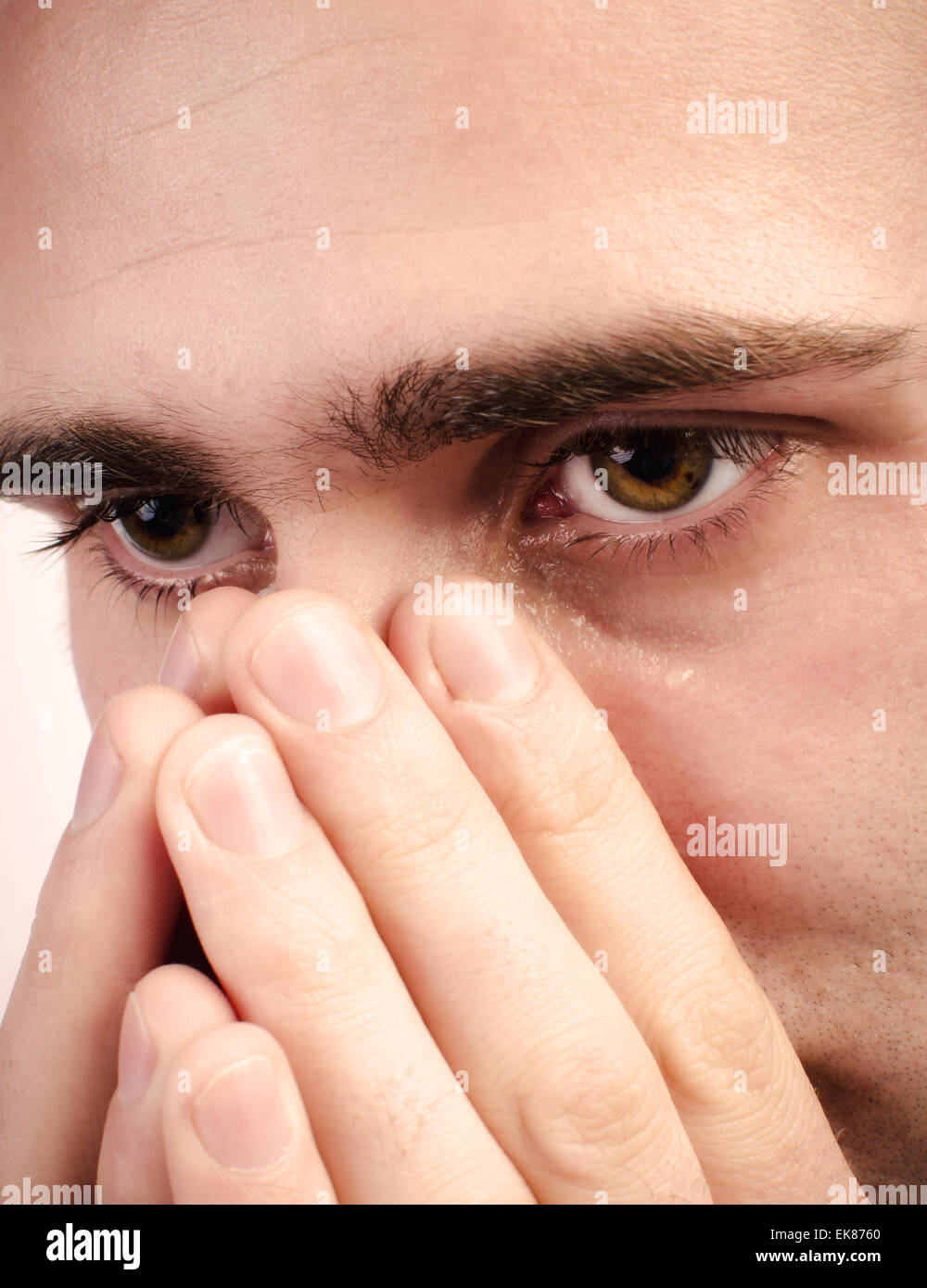 Young man crying tears close up hi-res stock photography and images - Alamy