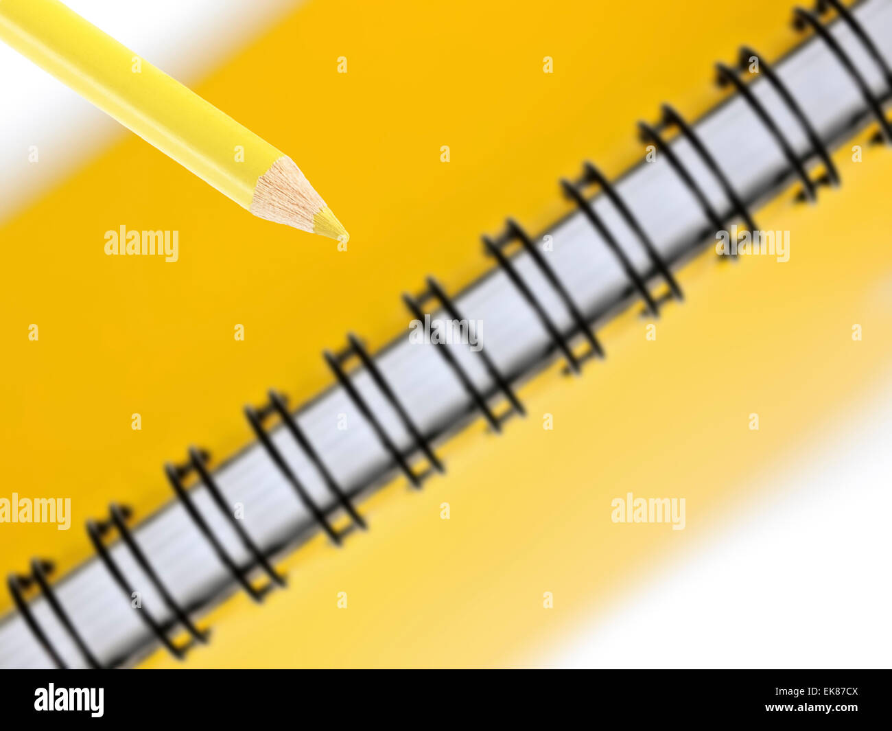 yellow pencil and notepad Stock Photo - Alamy