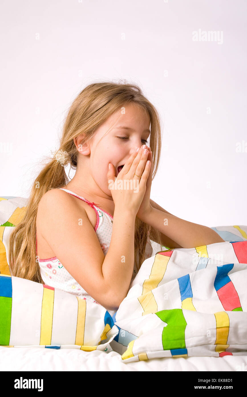 young girl yawning Stock Photo - Alamy