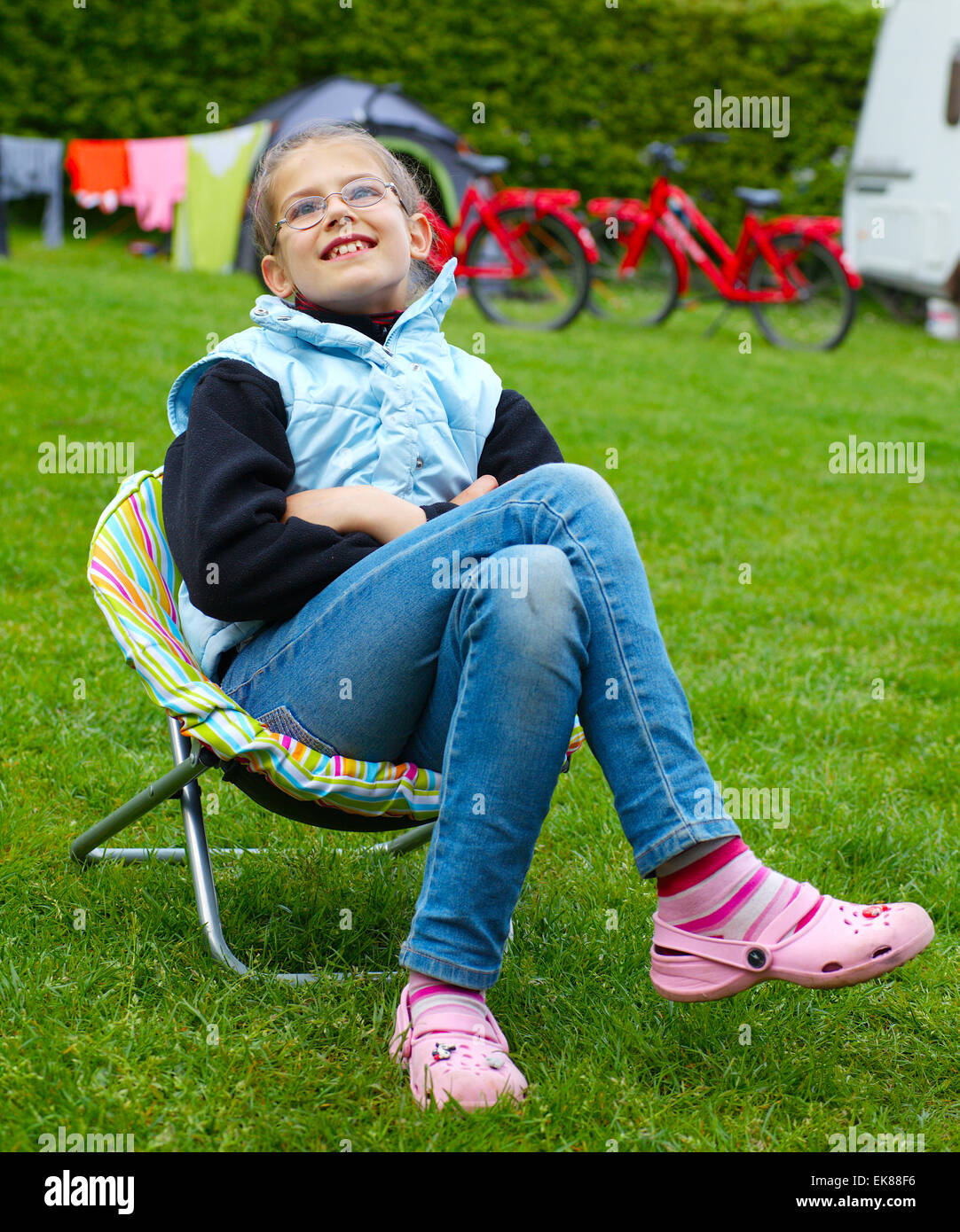 Cute girl rest in the camping Stock Photo - Alamy