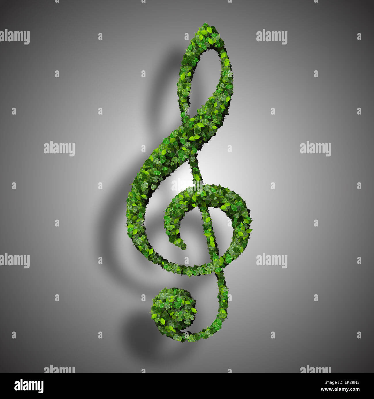 Musical note clef symbol made from green leaves isolated on white ...