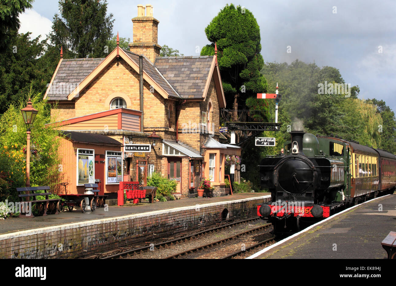 A GWR Pannier-tank 0-6-0 locomotive, no. 3650 draws a short passenger ...