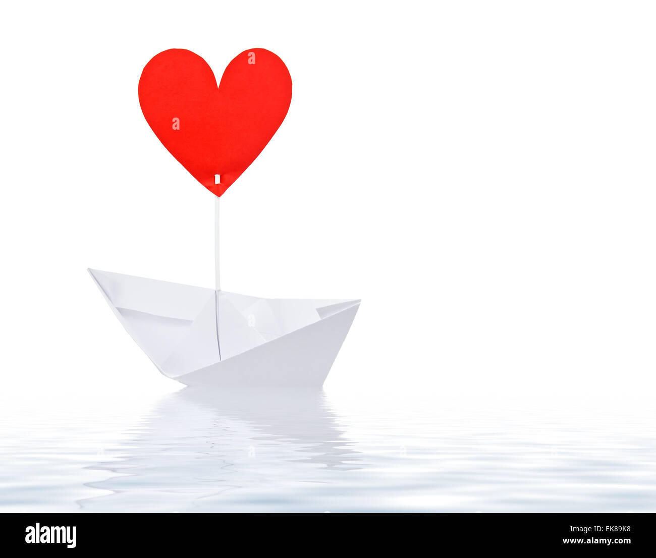 Paper ship with red heart sail Stock Photo - Alamy