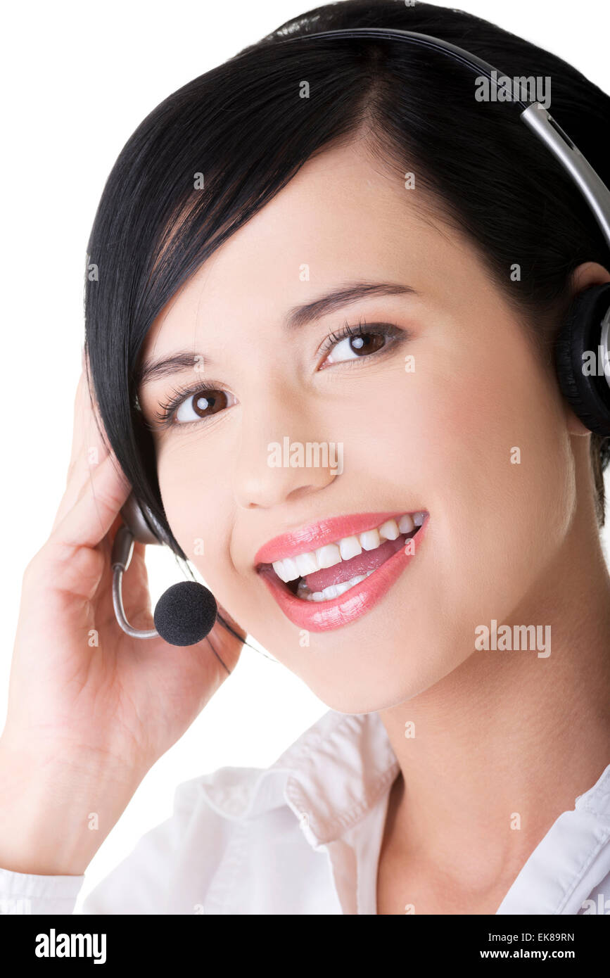 Beautiful young call-center assistant smiling Stock Photo - Alamy