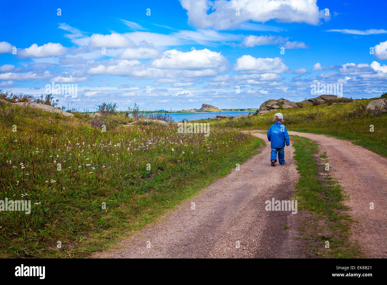 boy walking country road Stock Photo - Alamy