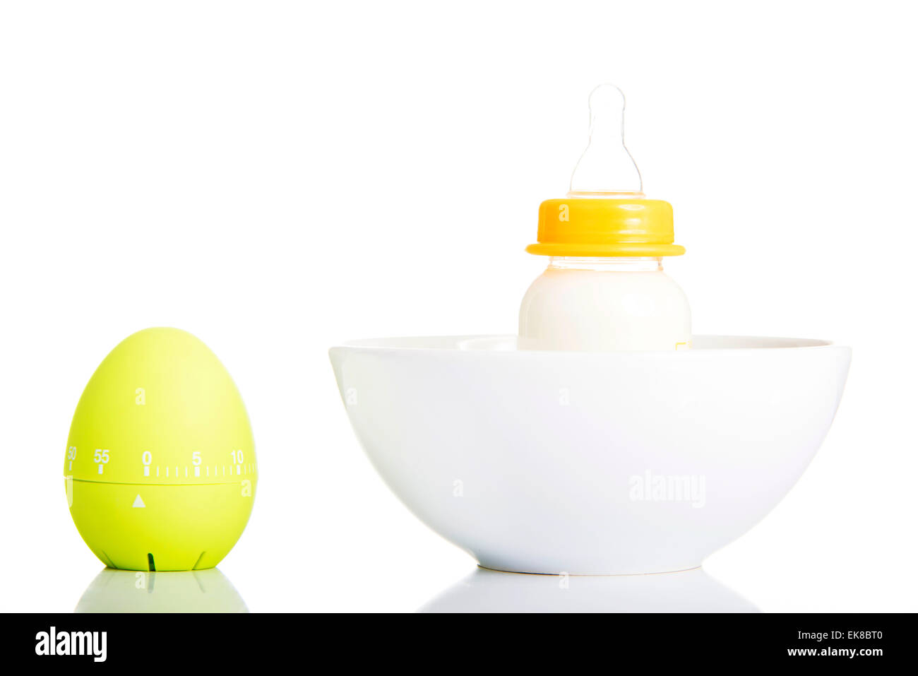 Baby milk bottle and timer Stock Photo - Alamy
