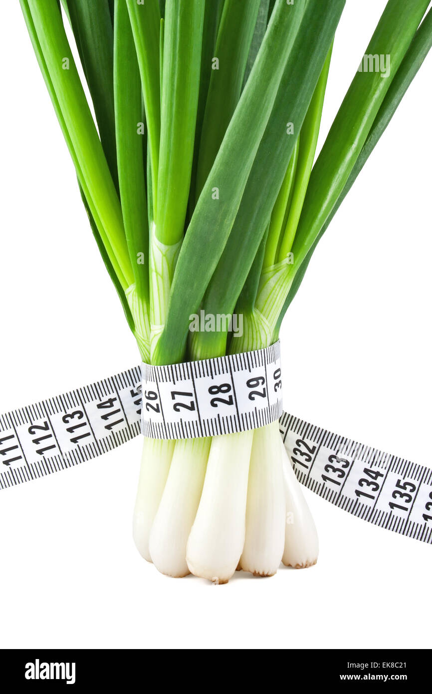 Measuring tape wrapped around a green onions Stock Photo - Alamy