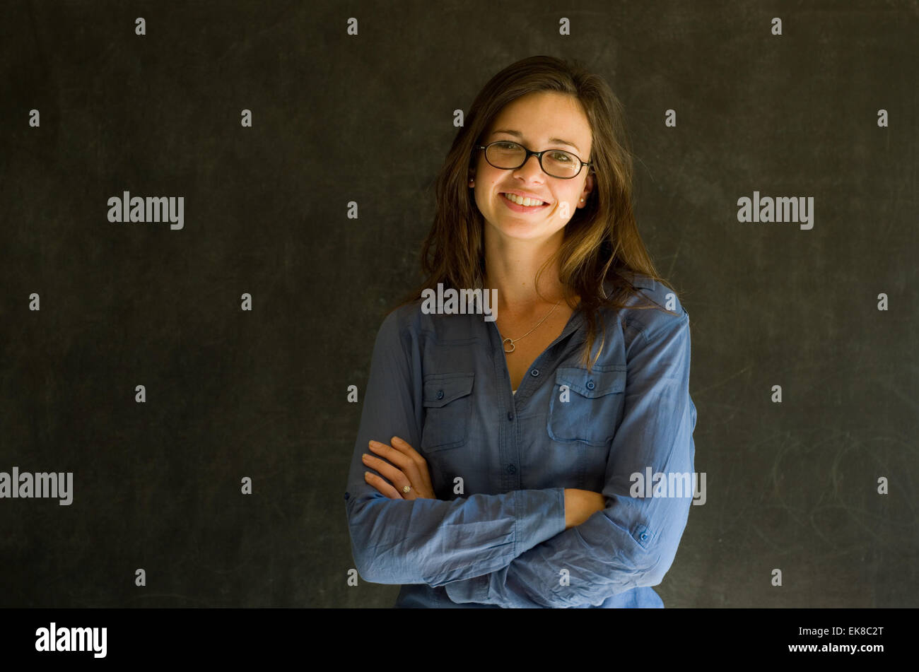 Confident woman against blackboard background Stock Photo - Alamy Confident woman against blackboard background Stock Photo - Alamy