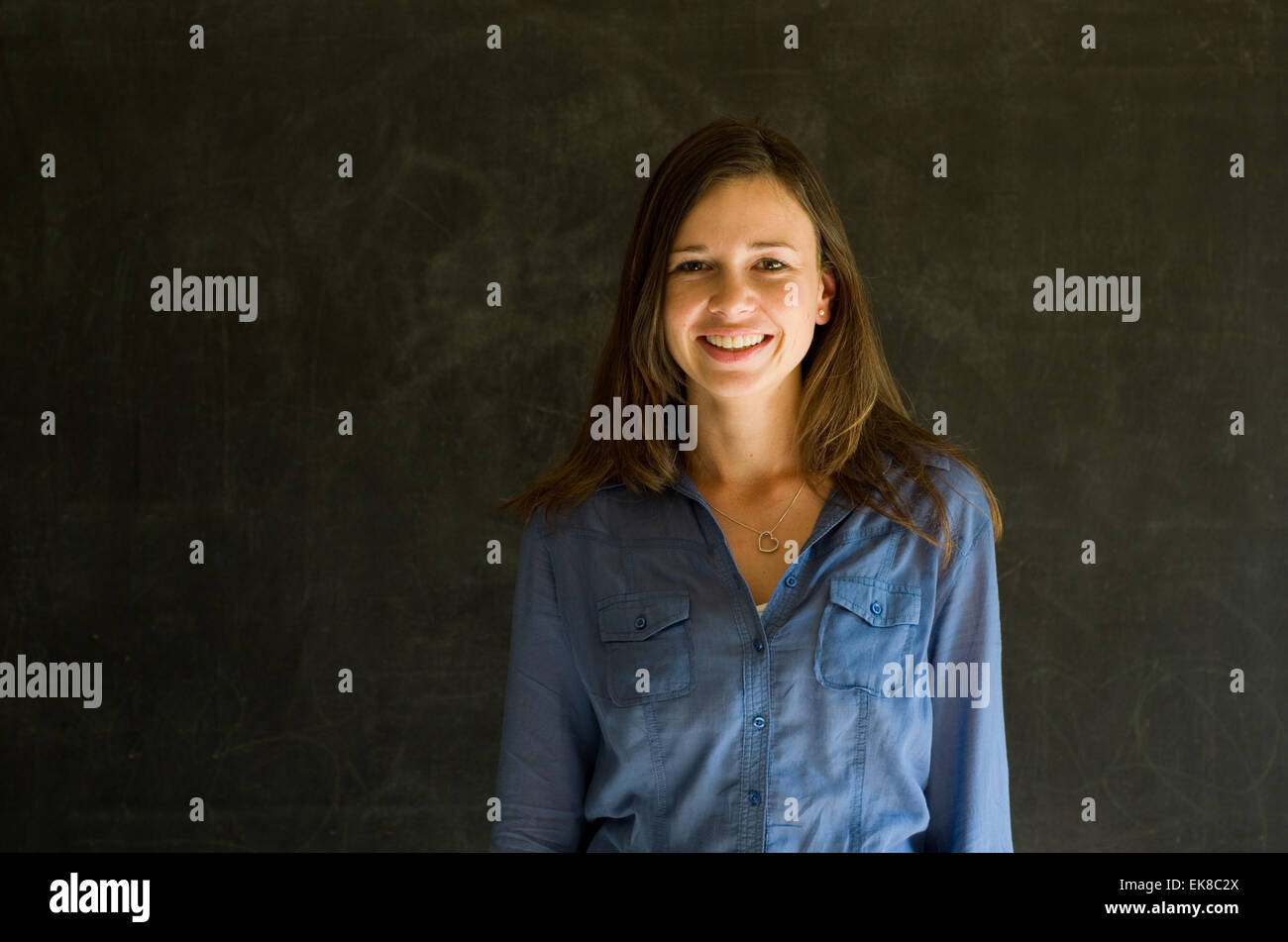 Confident woman against blackboard background Stock Photo - Alamy Confident woman against blackboard background Stock Photo - Alamy