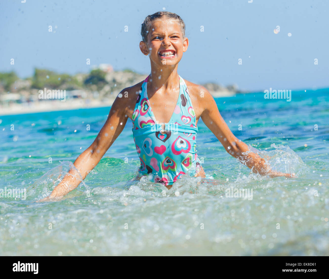 Girl swimming in sea Stock Photo - Alamy