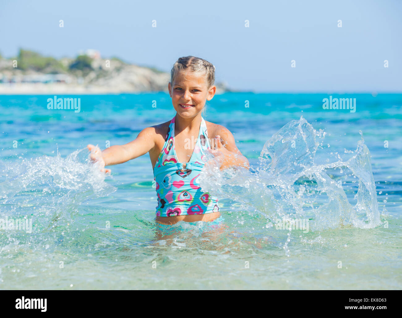 Girl swimming in sea Stock Photo - Alamy