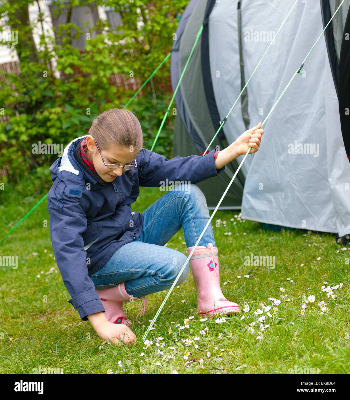 Camping in tent - happy girl on camp tent Stock Photo - Alamy