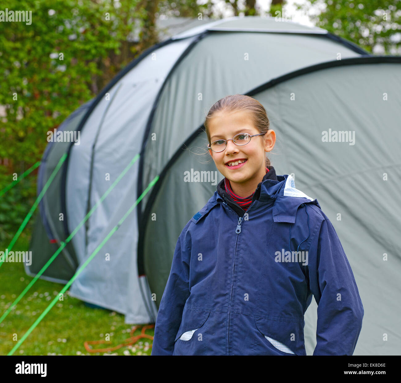 Camping in tent - happy girl on camp tent Stock Photo - Alamy
